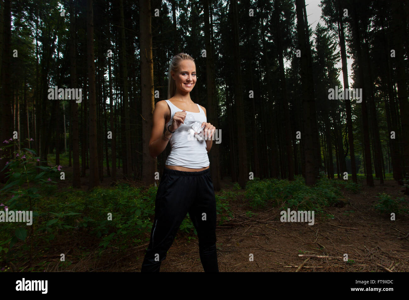 smiling jogger with a water bottle Stock Photo - Alamy