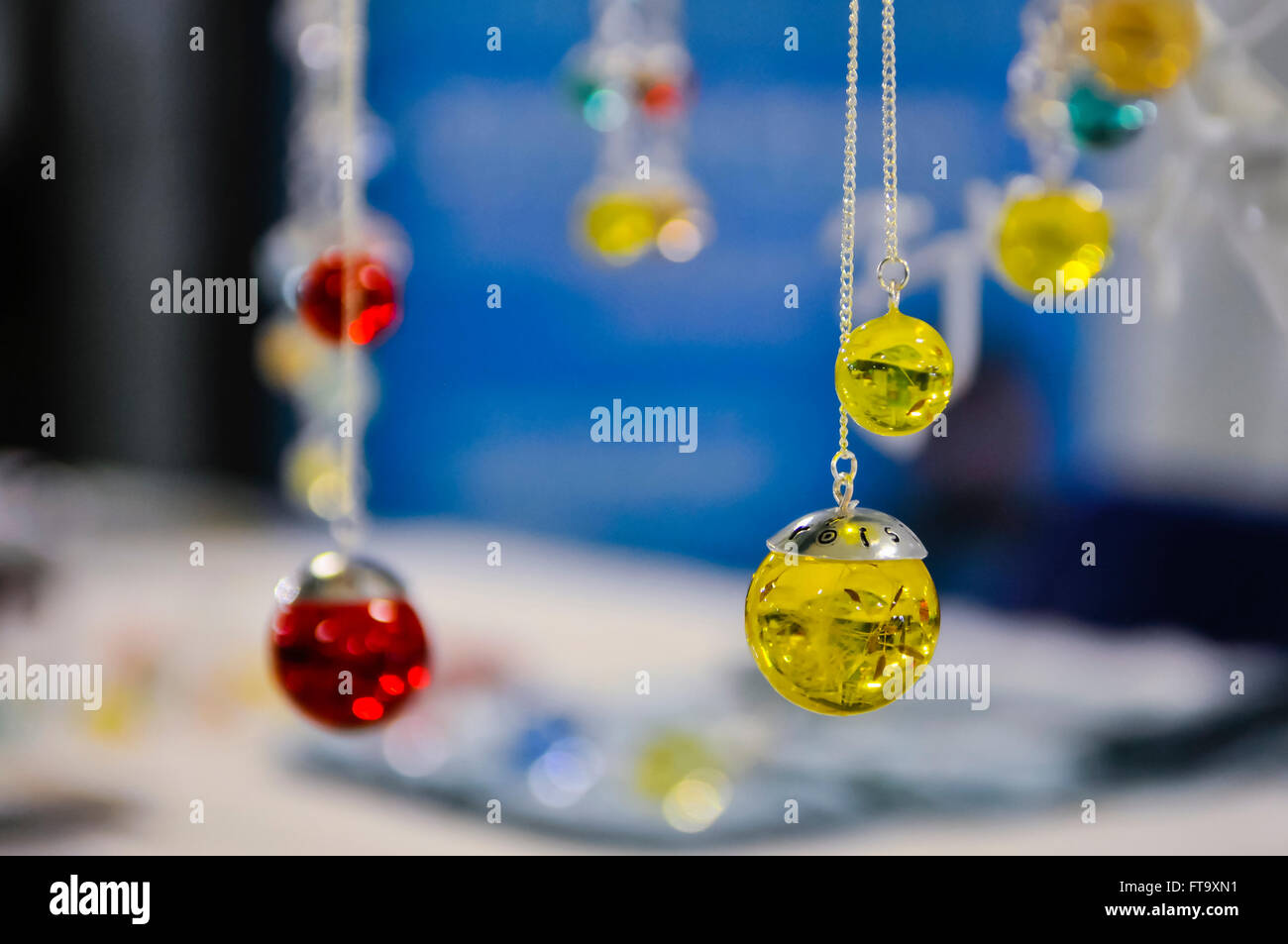 Homemade gem crystal jewelry on display at a market stall, which are ...