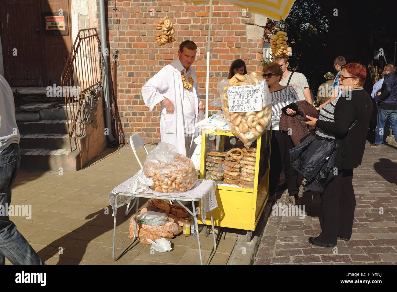 Tourist buying traditional food in ancient Polish societies made of ...