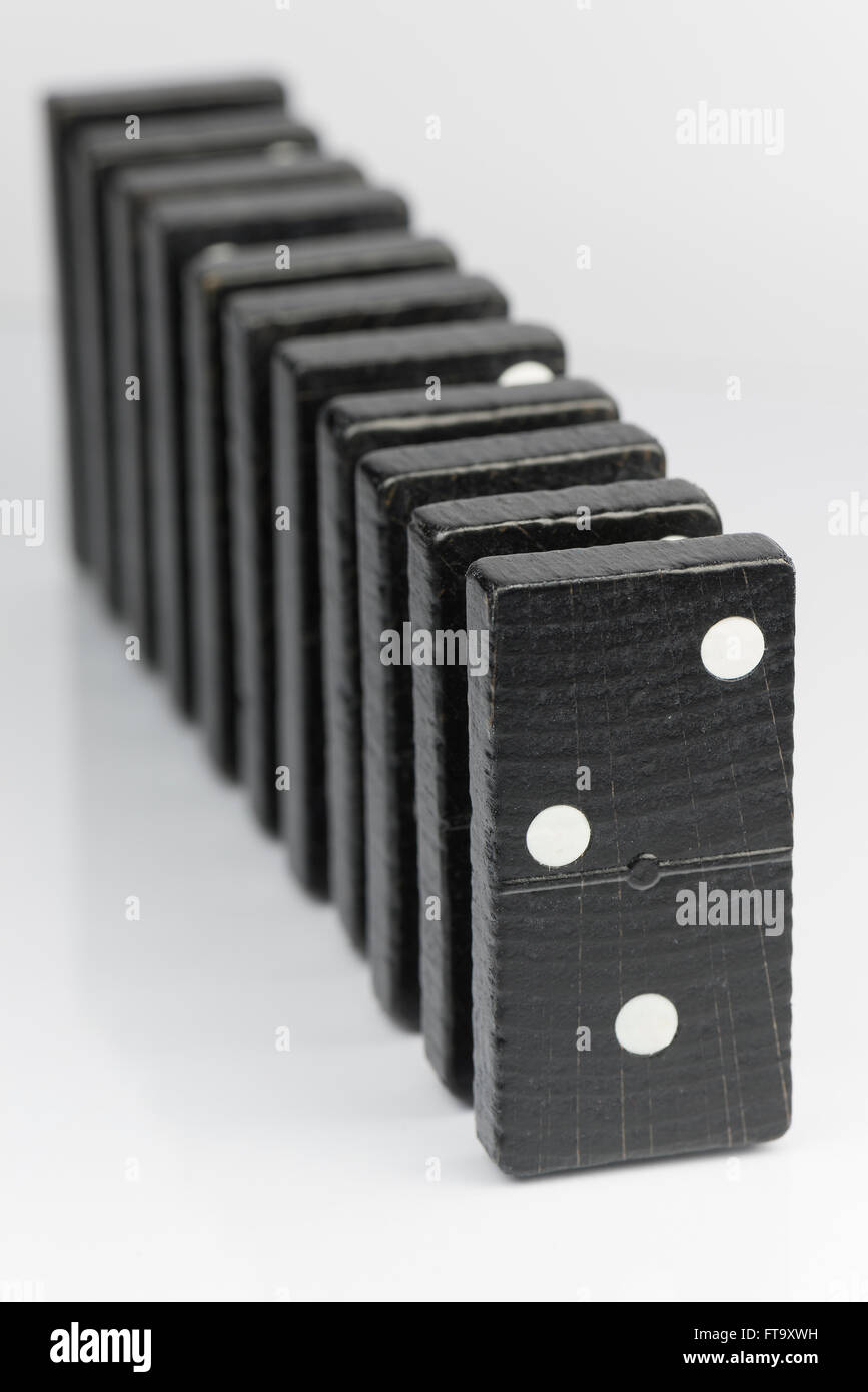Composition of standing black domino bricks with white dots Stock Photo ...