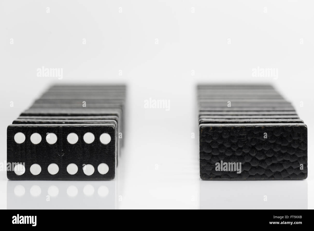 Composition of standing black domino bricks with white dots Stock Photo ...