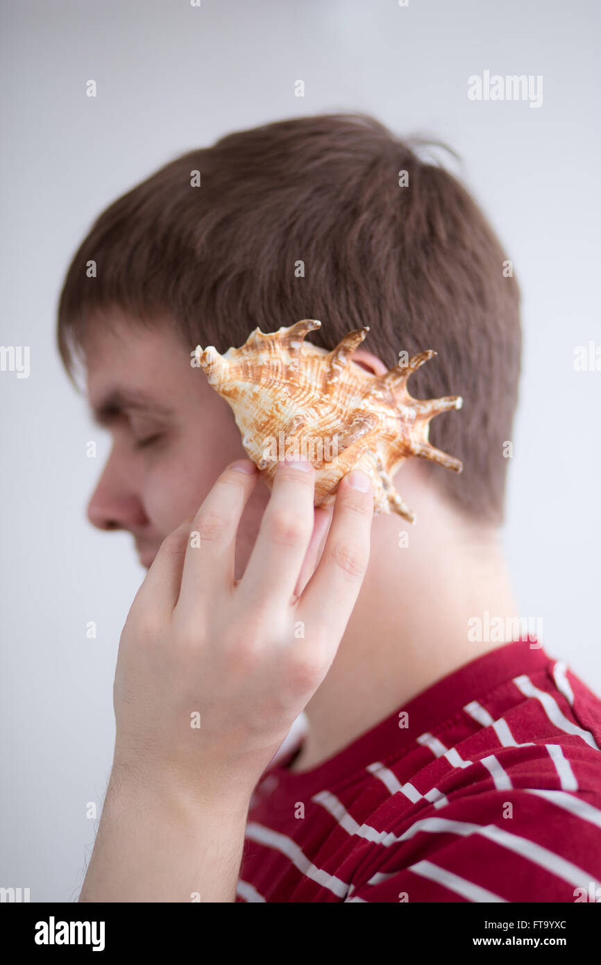 Holding a conch hi-res stock photography and images - Alamy