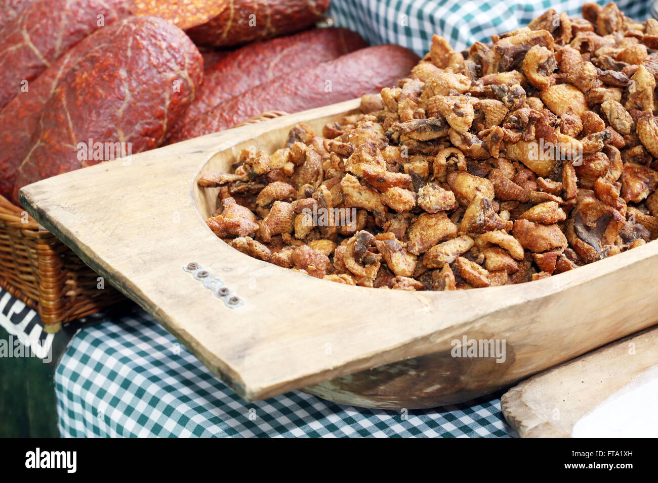 Goose cracklings greaves placed in a traditional vessel from wood ...