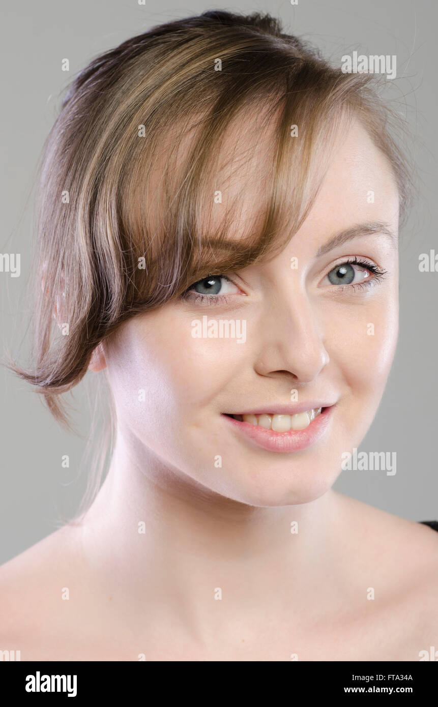 Beautiful young woman smiling Stock Photo - Alamy