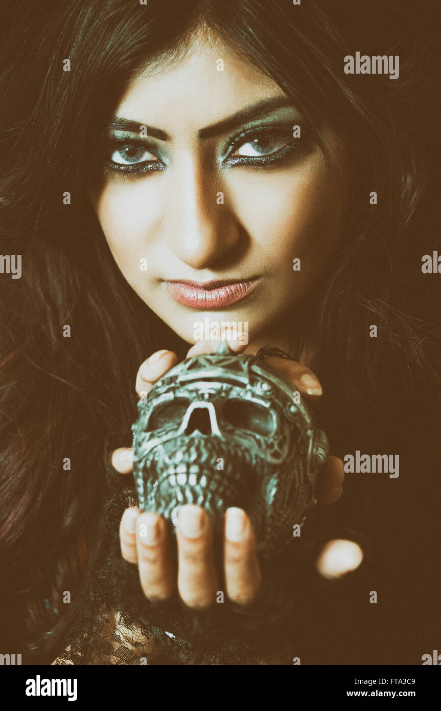 Woman holding skull hi-res stock photography and images - Alamy