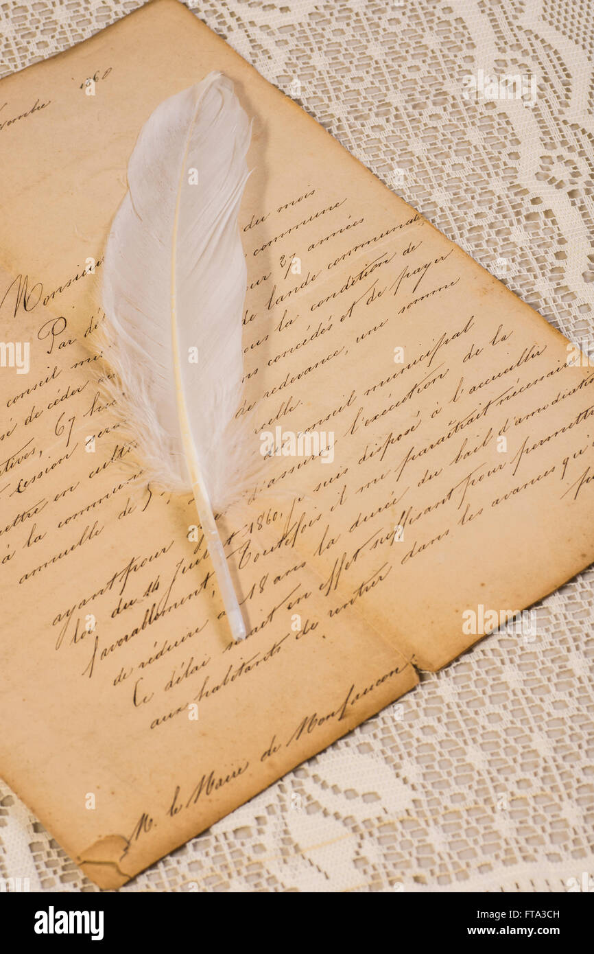 Old letter with a feather Stock Photo - Alamy