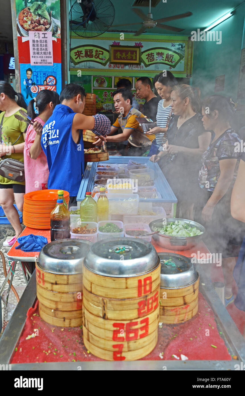 Food is prepared at a steamer restaurant in Guilin, China Stock Photo ...