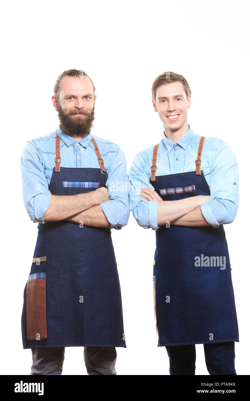 two bartender with a shaker and bottle on white background. behind the ...