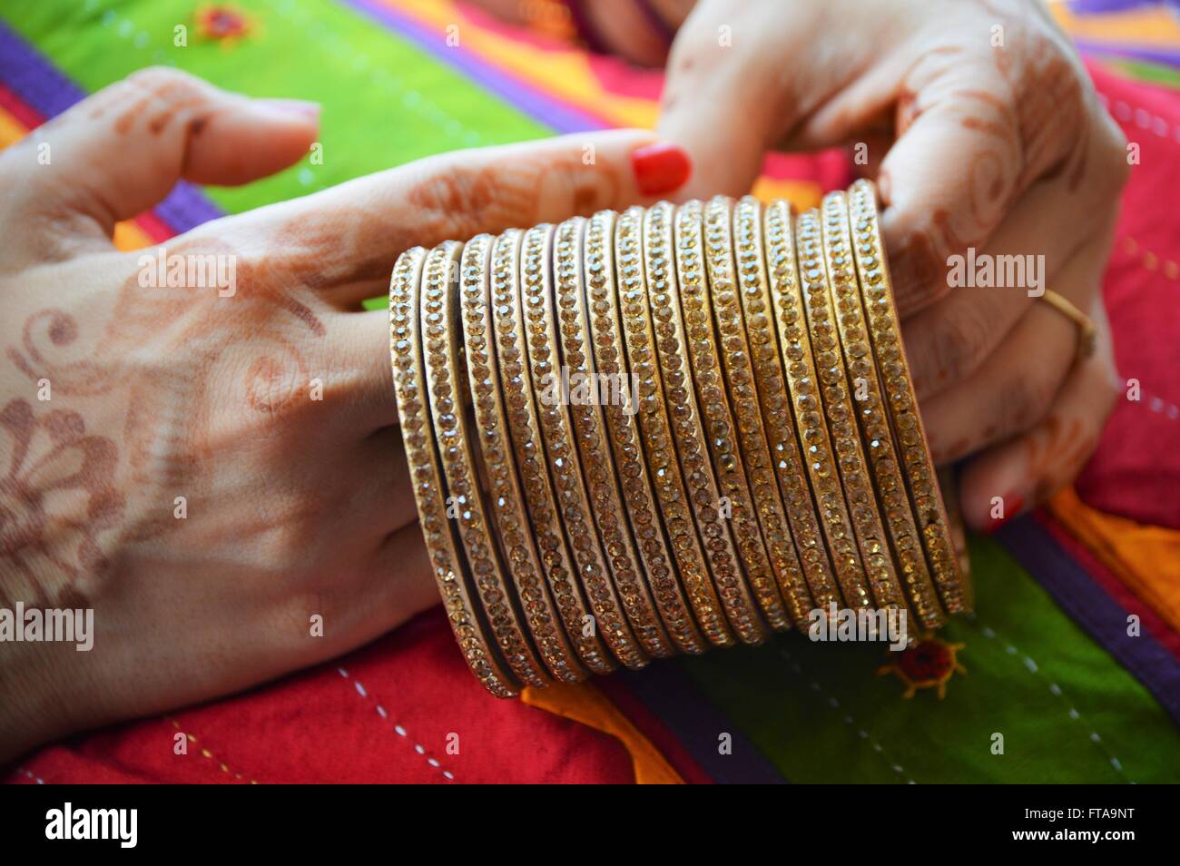 Colorful Bangles being worn by an Indian girl Stock Photo - Alamy