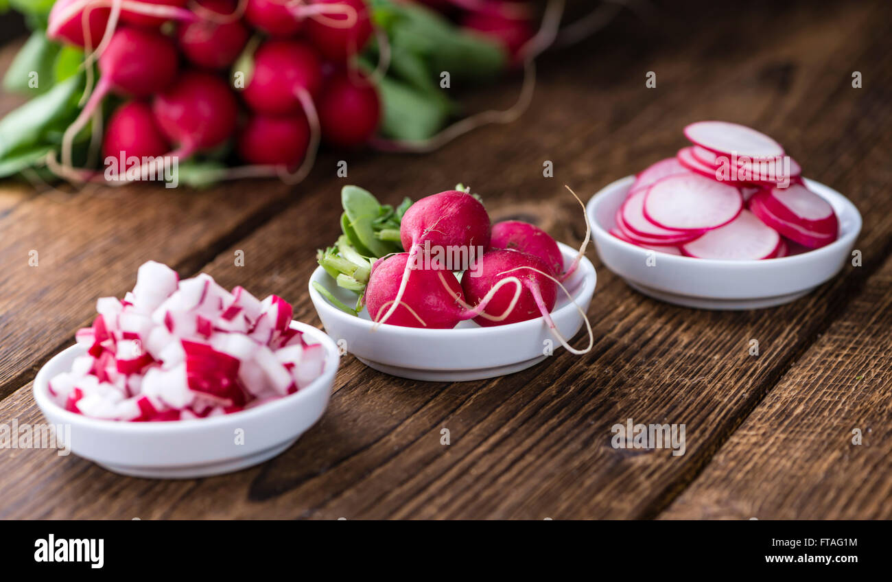 Radishes (whole, sliced and diced) as detailed close-up shot (selective ...