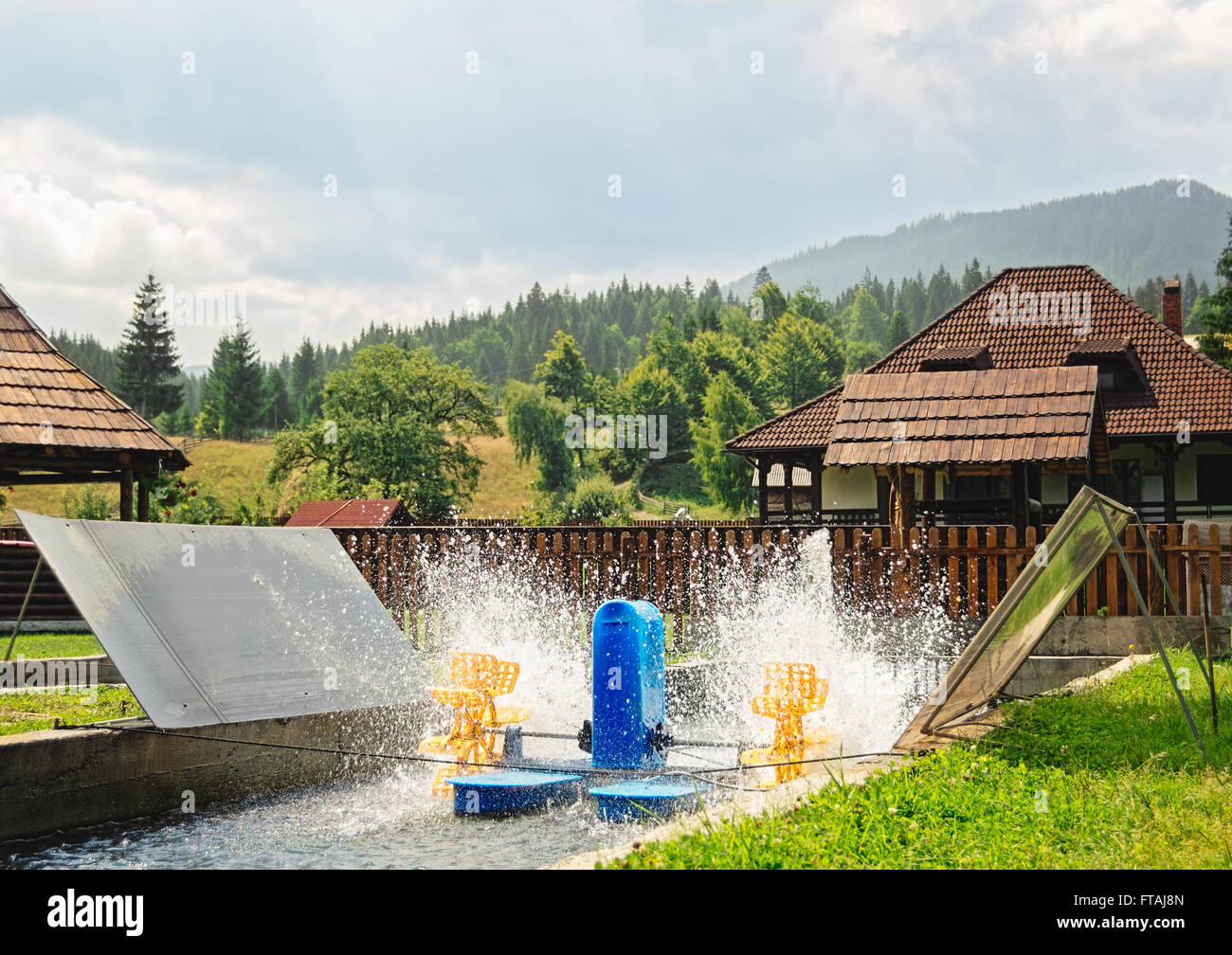 Paddle wheeled aeration device in a trout basin Stock Photo - Alamy
