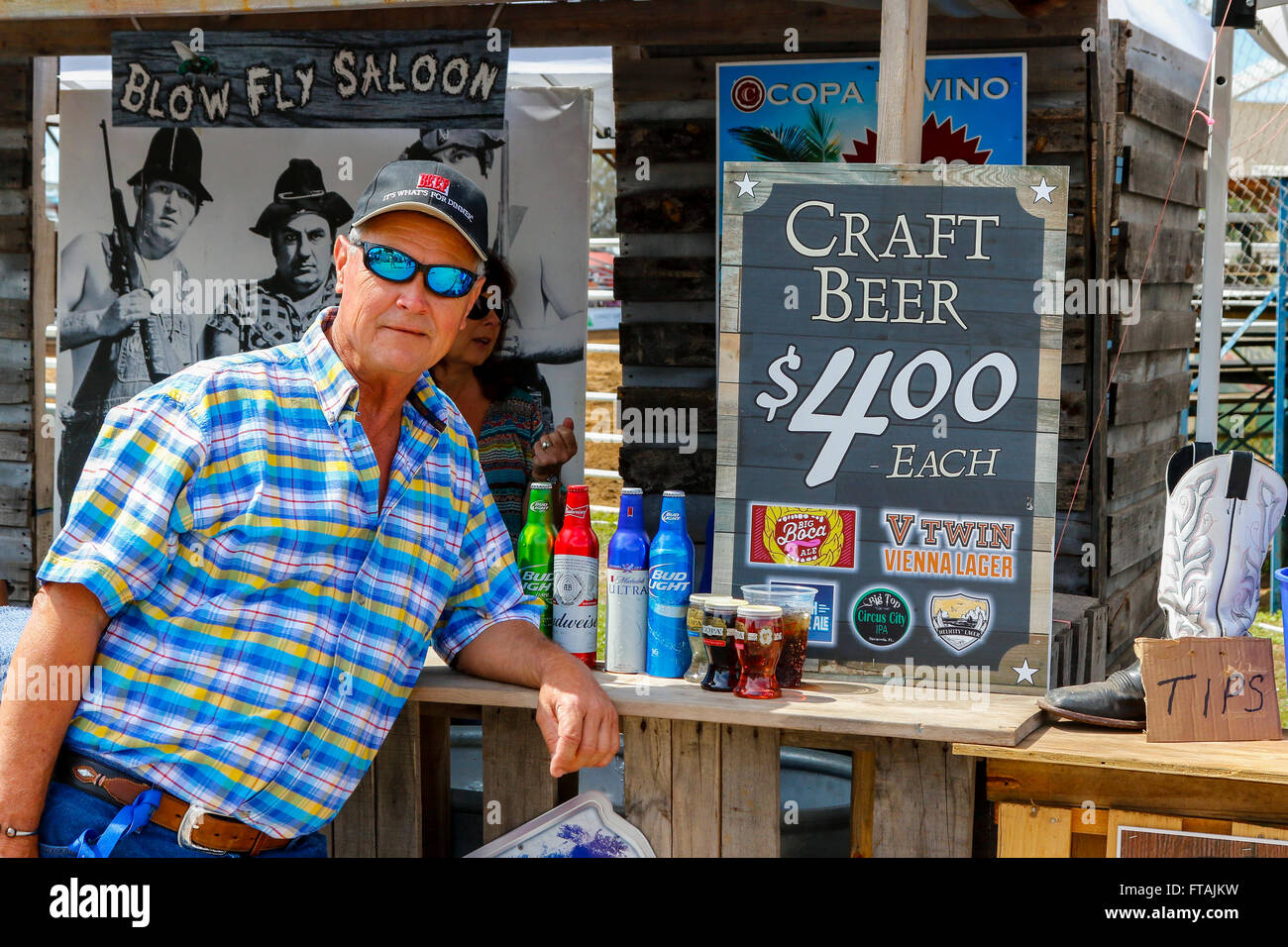 Man selling beer and soft drinks from a stall at Arcadia Rodeo, Florida ...
