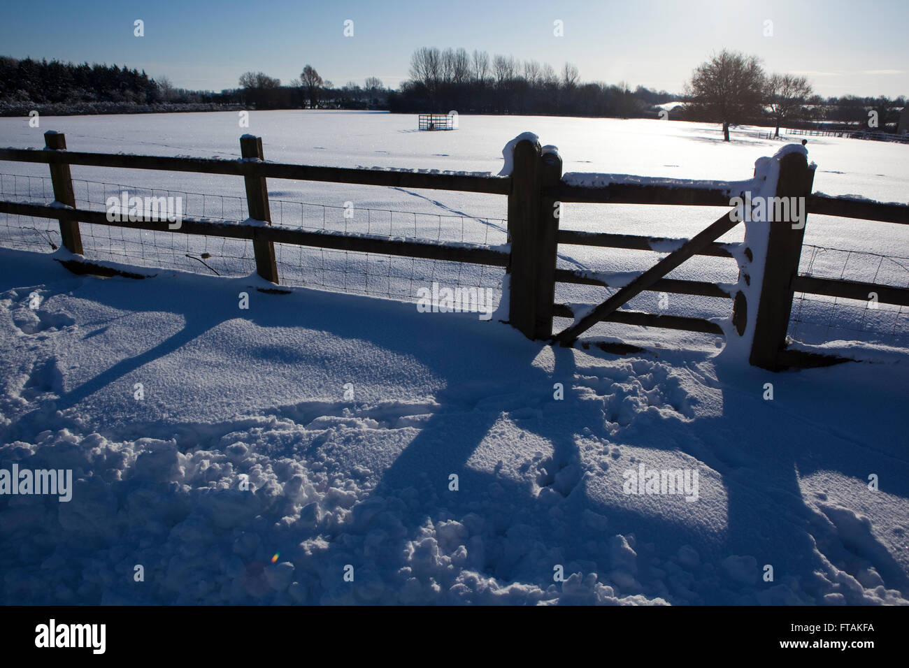 A gate set in a country side fence on a farm in the uK, the winter ...