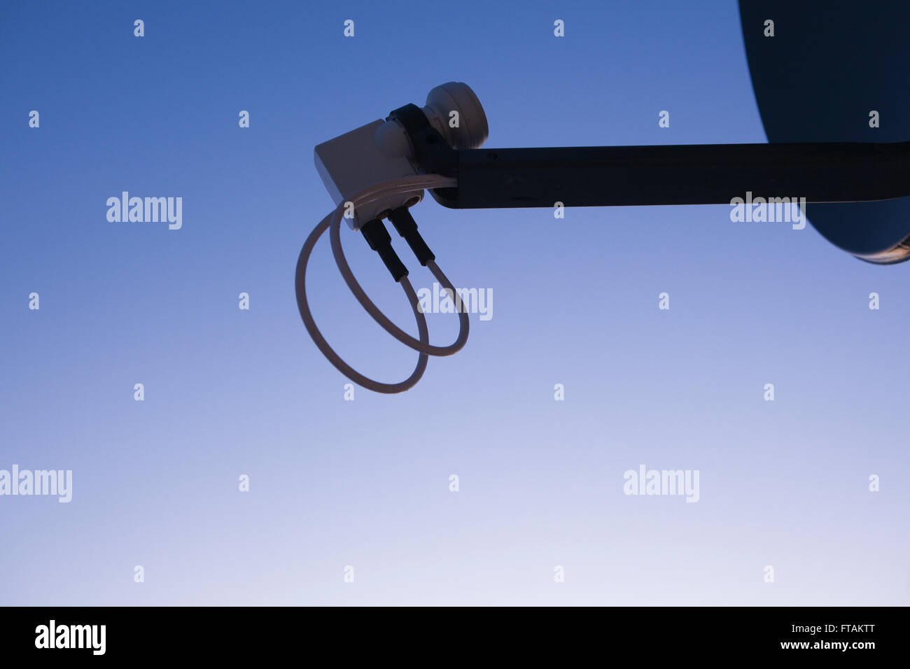 Satellite dish and receiver on the side of a house Stock Photo - Alamy