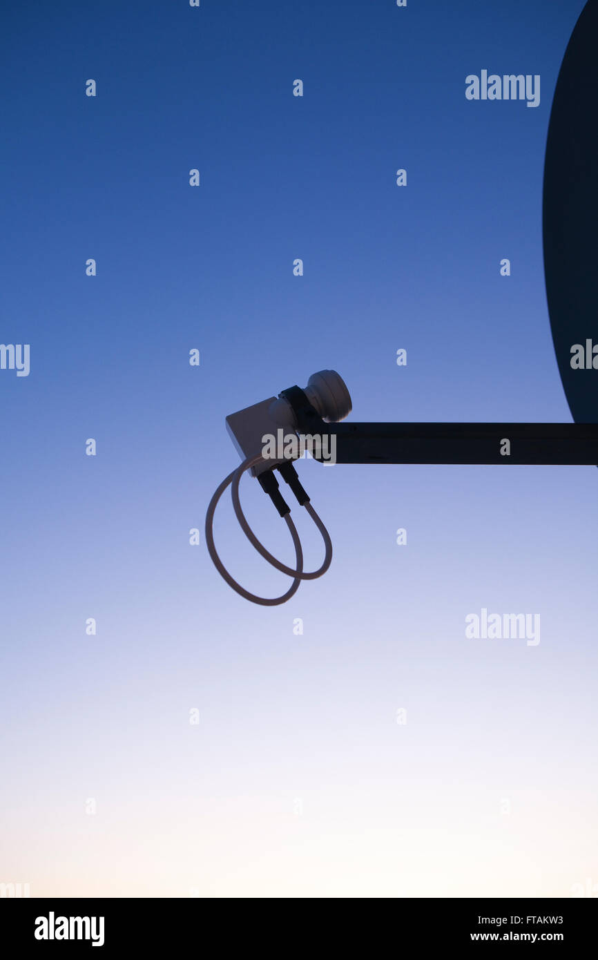 Satellite dish and receiver on the side of a house Stock Photo - Alamy