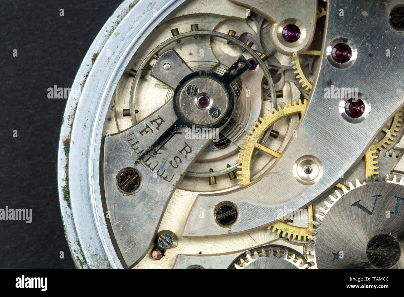 Inside workings of old pocket watch on a black background Stock Photo ...
