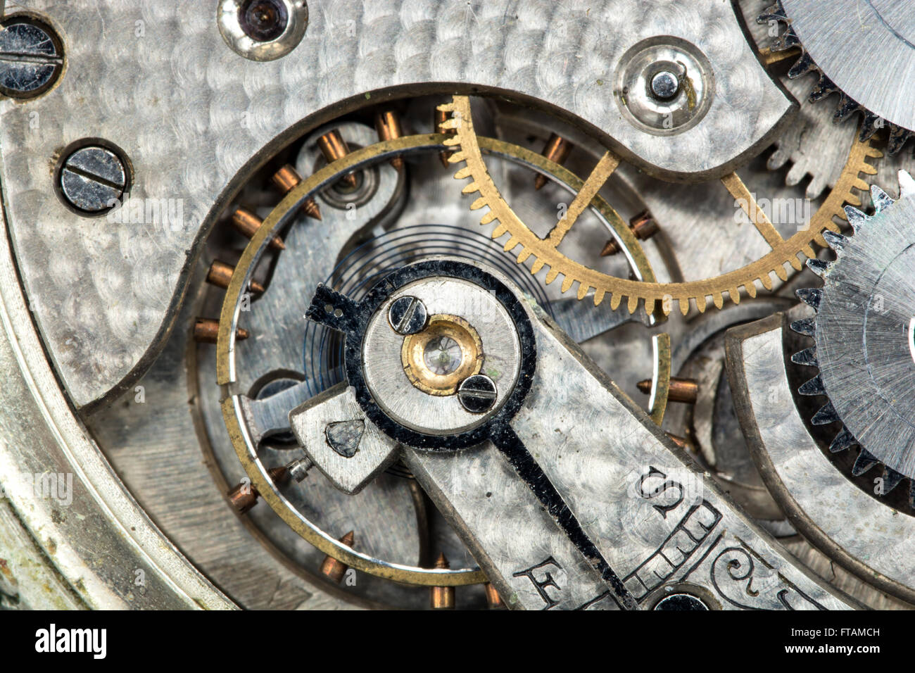 Inside workings of old pocket watch Stock Photo - Alamy