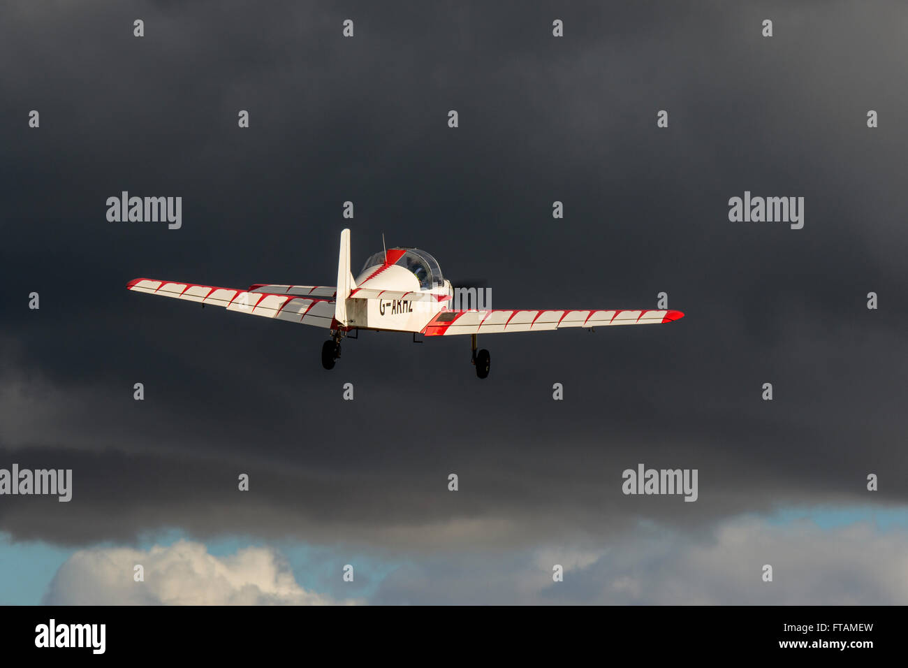 Druine (Rollason) D.62 Condor G-ARHC in flight against a stormy sky at ...