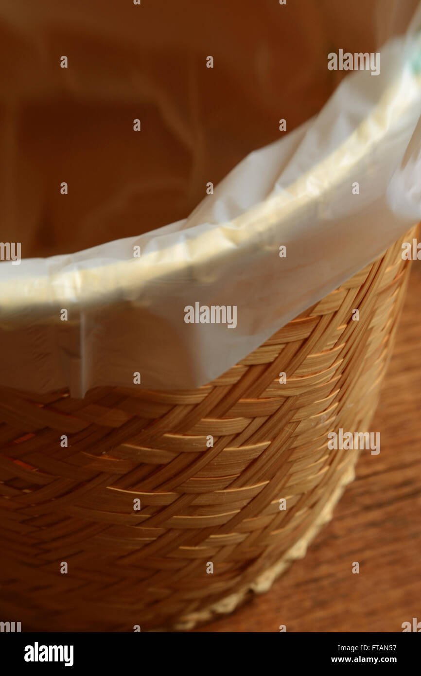 woven reed waste basket with plastic bag as lining Stock Photo - Alamy
