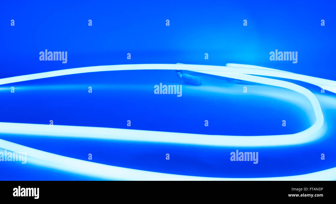 Neon glowing blue lights Stock Photo - Alamy