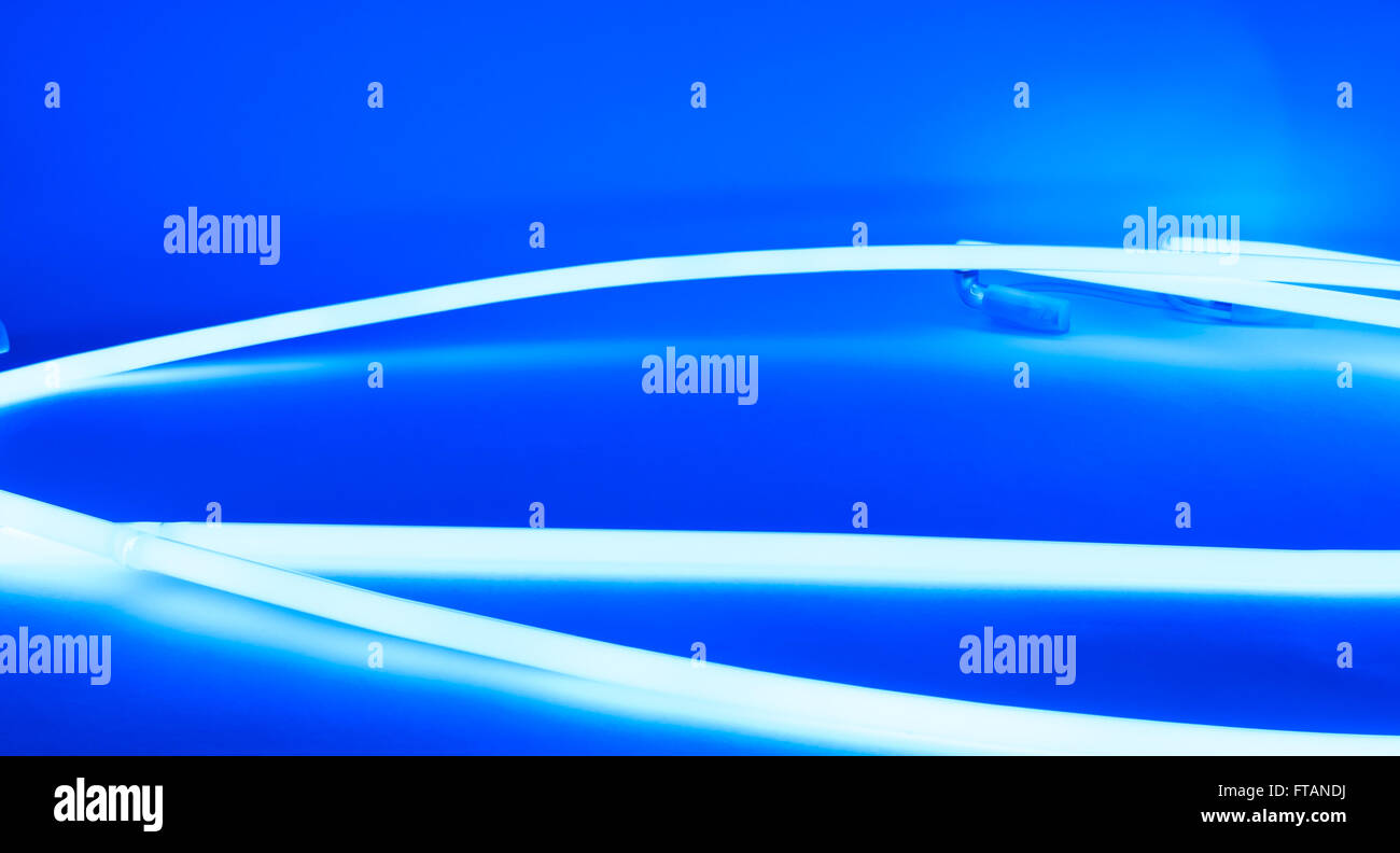 Blue neon lights abstract background Stock Photo - Alamy