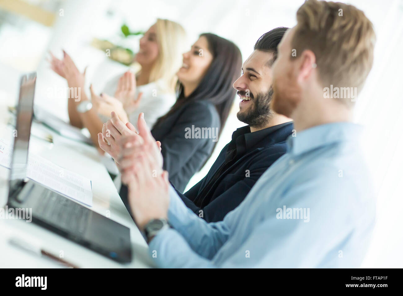 View of the business people clapping in the office Stock Photo - Alamy