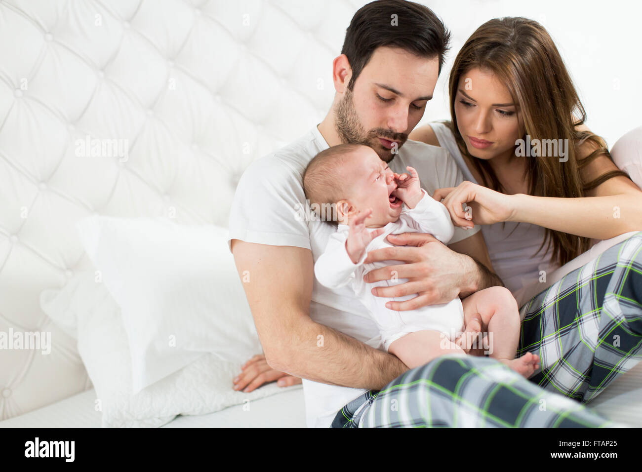Happy family with newborn baby Stock Photo - Alamy