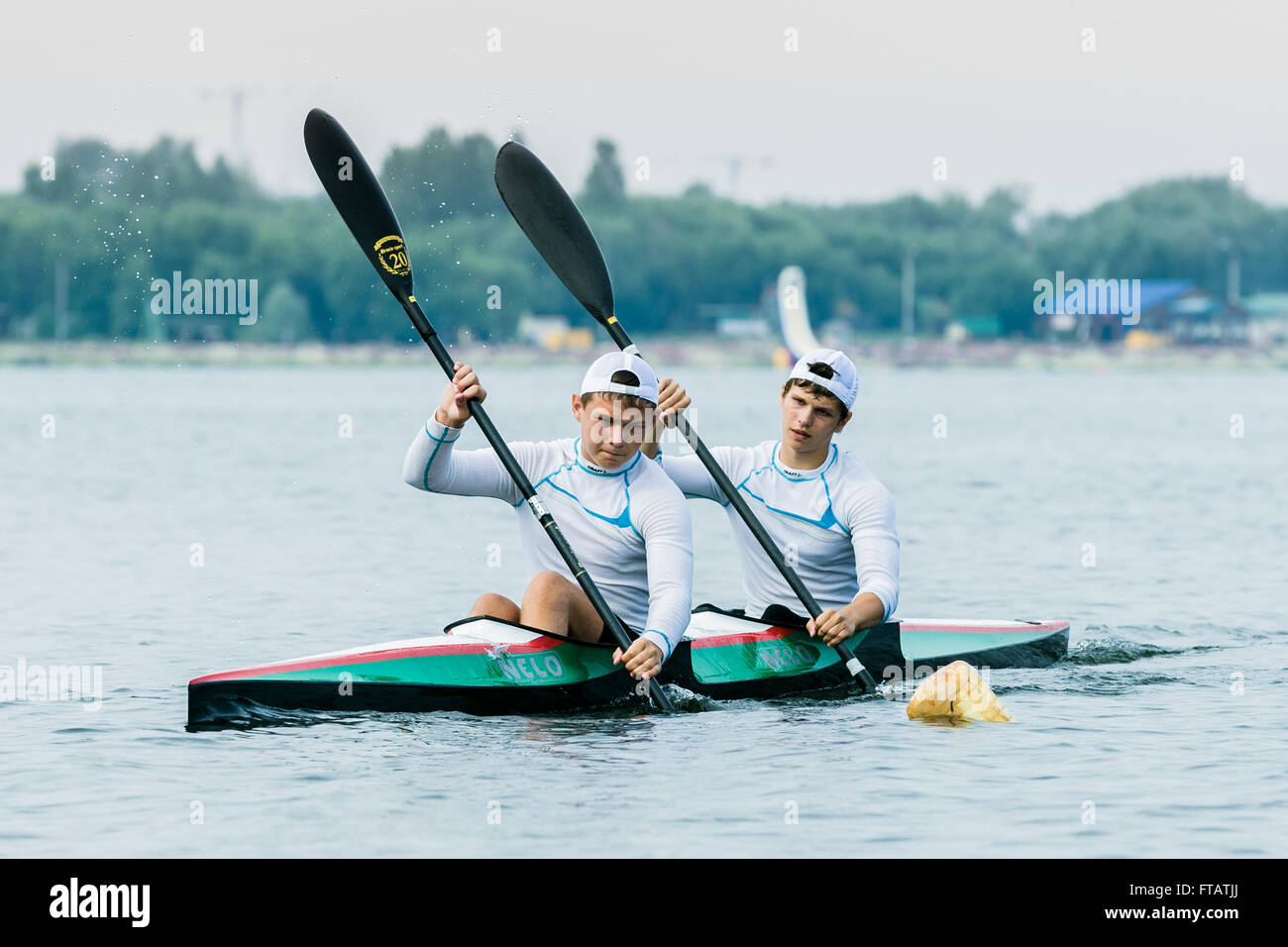 Chelyabisk, Russia - June 25, 2015: two young athletes rower rowing in ...