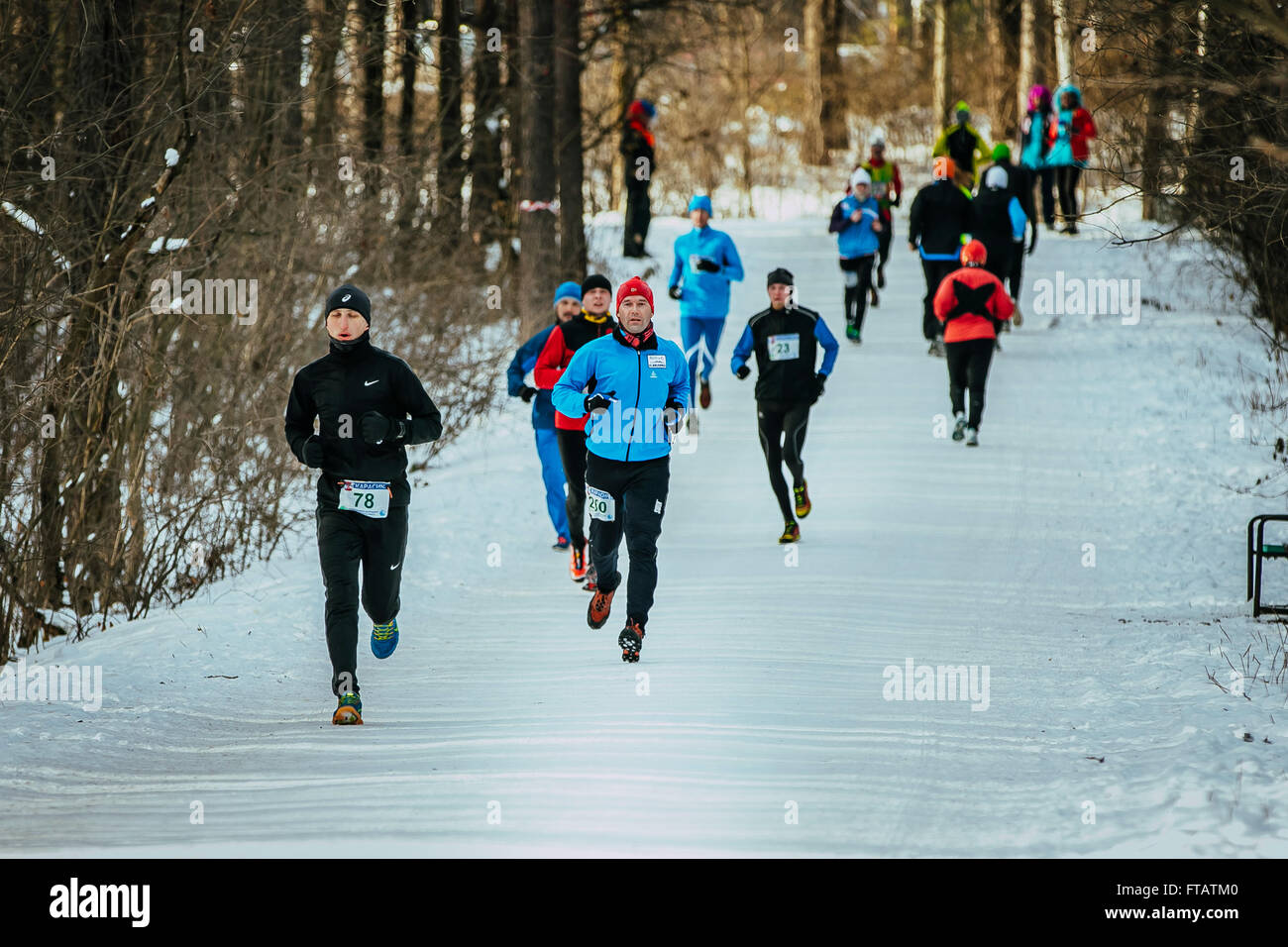 Adult running through snow hi-res stock photography and images - Alamy