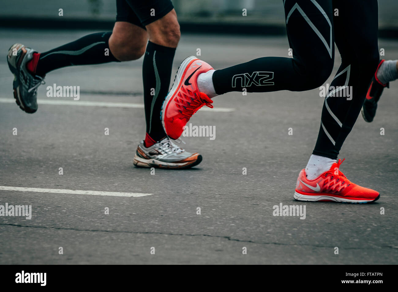 Omsk, Russia - September 20, 2015: two runners are running during ...