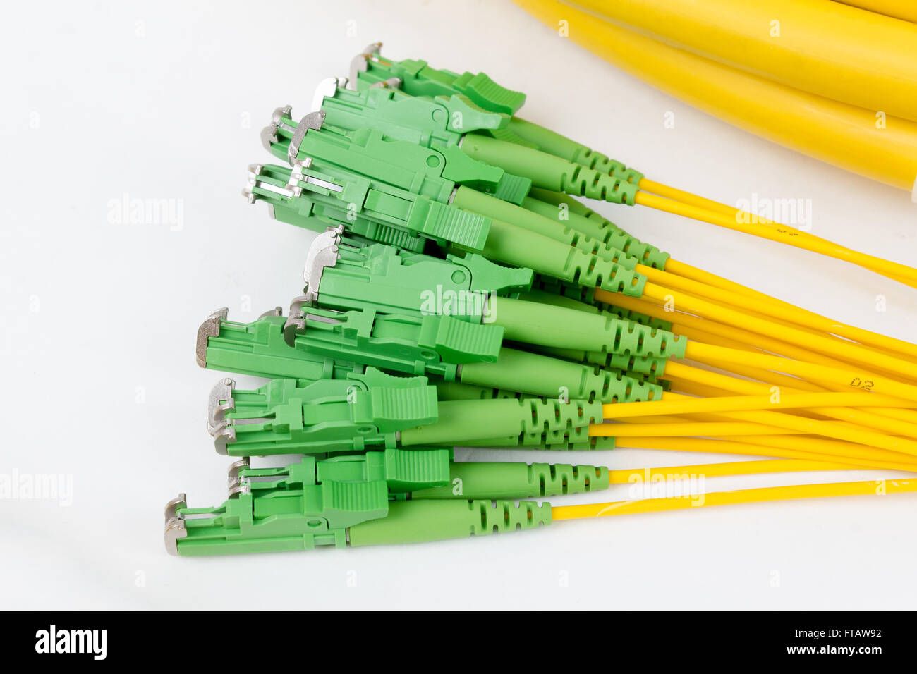 fiber optic E2 (LSH) pigtail, patchcord connectors on white background ...