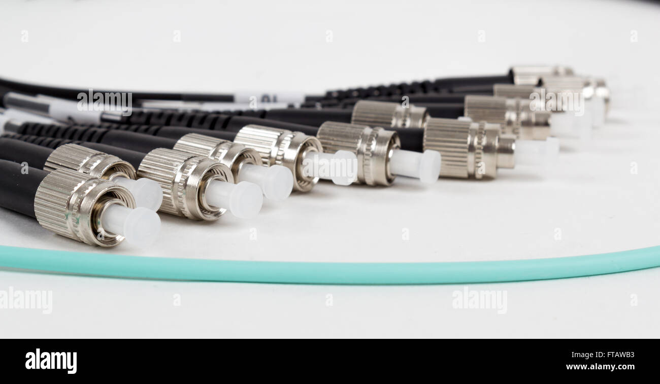 covered fiber optic ST connectors on white background Stock Photo - Alamy
