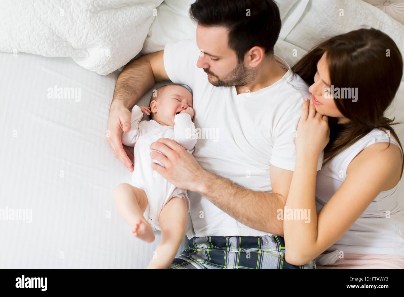 Happy family with newborn baby Stock Photo - Alamy