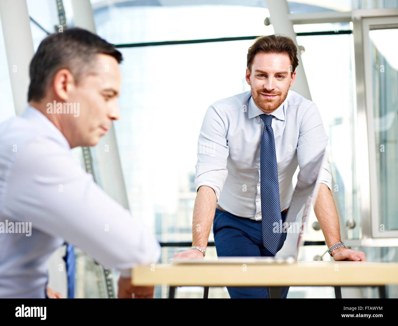 two corporate people working in office Stock Photo - Alamy