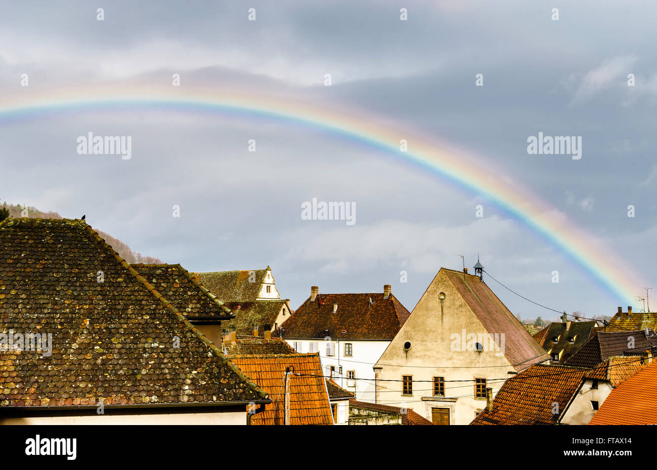 Spring rain and rainbow over little french village, Alsace Stock Photo ...