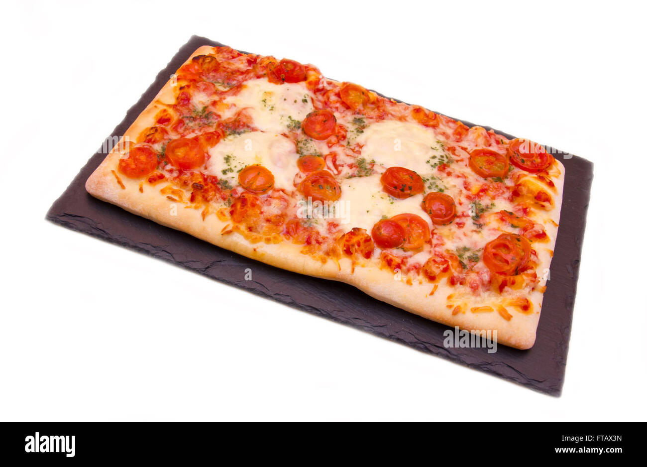 Pizza on plate slate on white background Stock Photo - Alamy