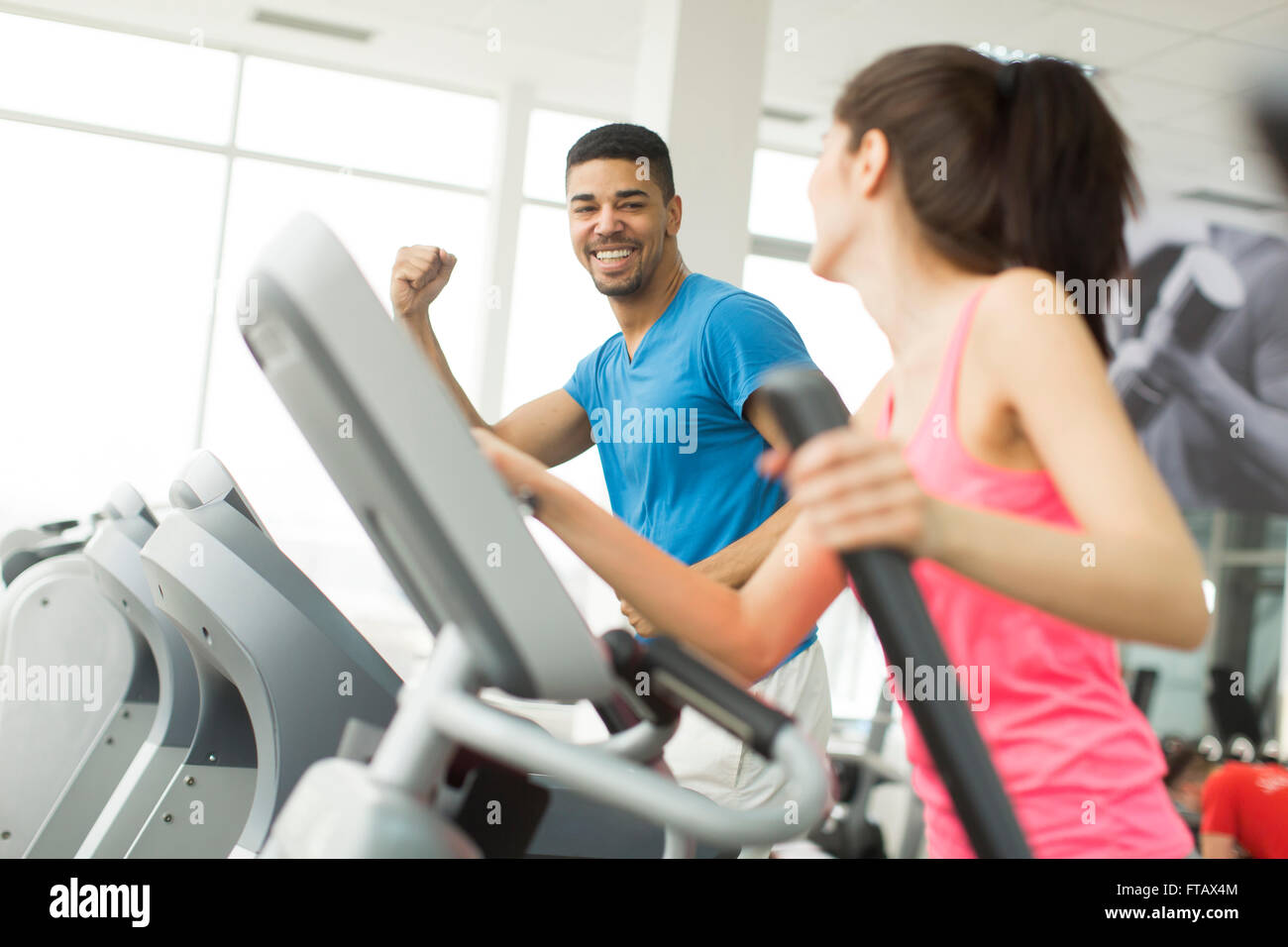 Young multiracial people training in the gym Stock Photo - Alamy