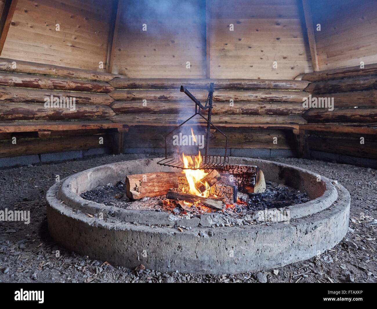 Smoke rising from outdoor fire place in a barbecue hut Stock Photo - Alamy
