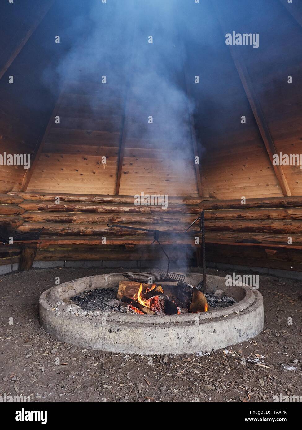 Smoke rising from outdoor fire place in a barbecue hut Stock Photo - Alamy
