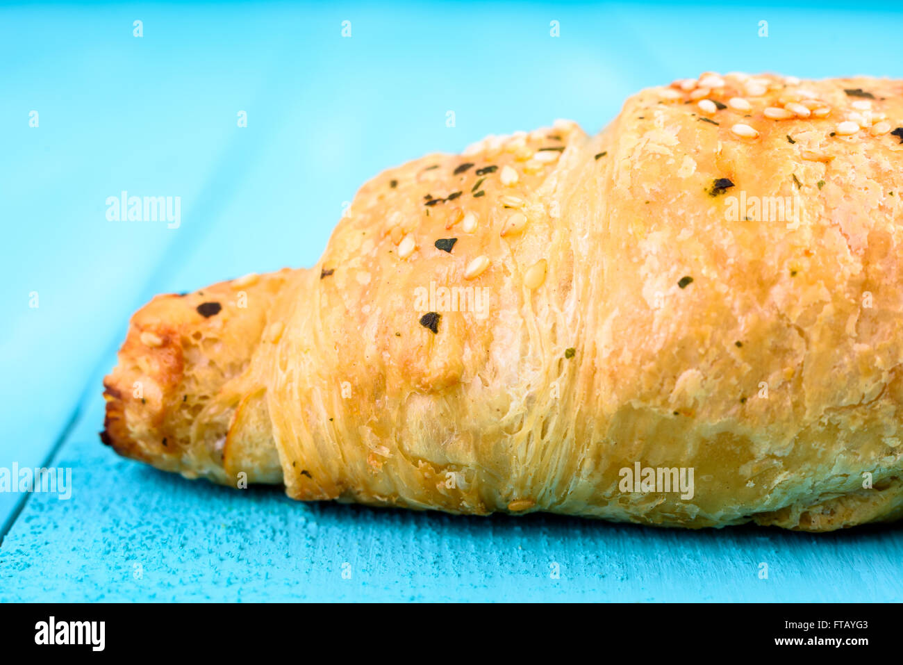 Fresh Croissant On Blue Table Stock Photo - Alamy