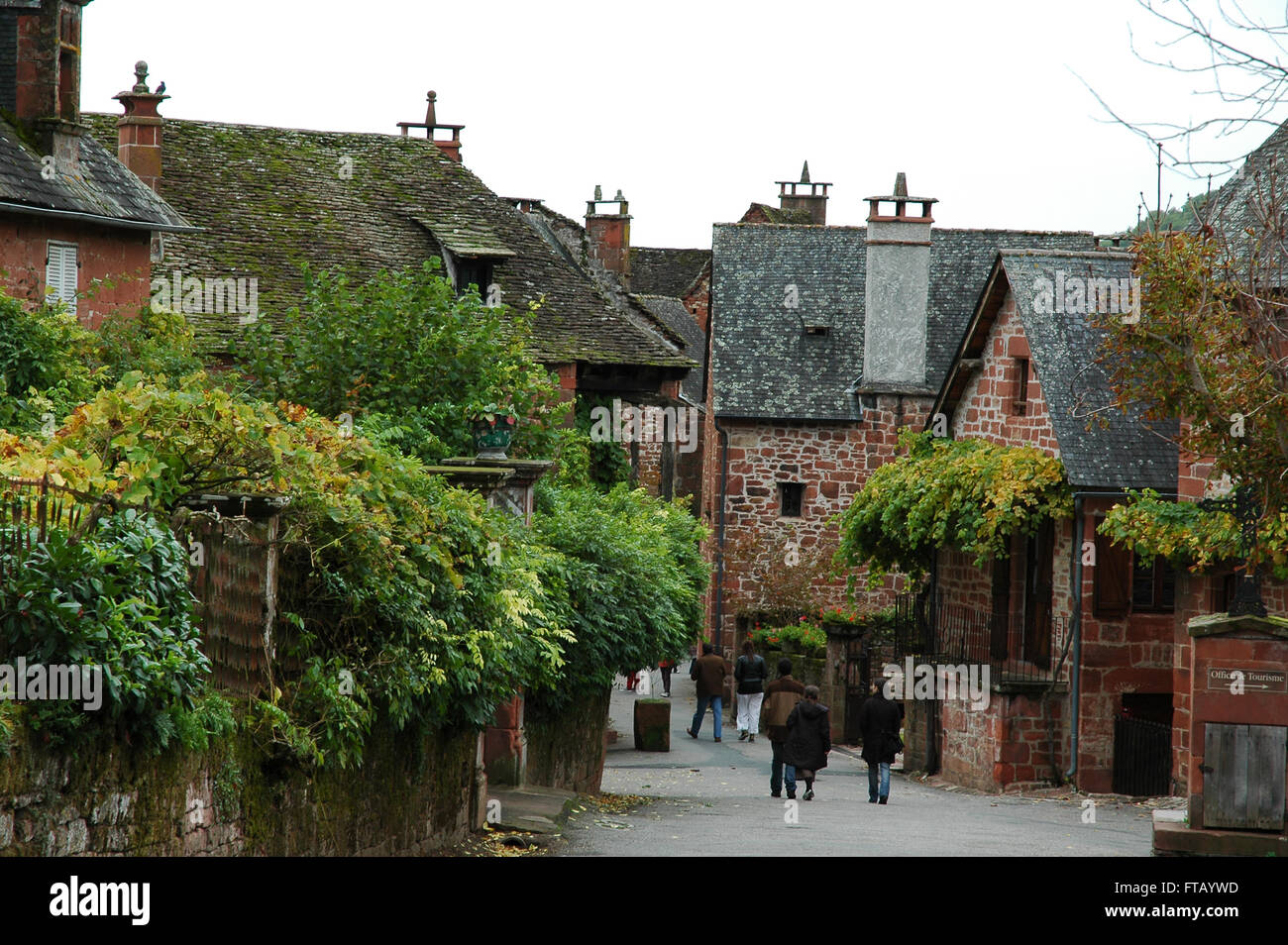 Visitors exploring Collonges-La-Rouge Stock Photo - Alamy