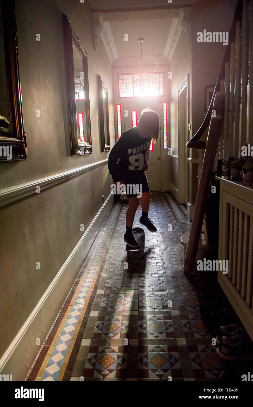 Skateboarding indoors in a Victorian house Stock Photo - Alamy