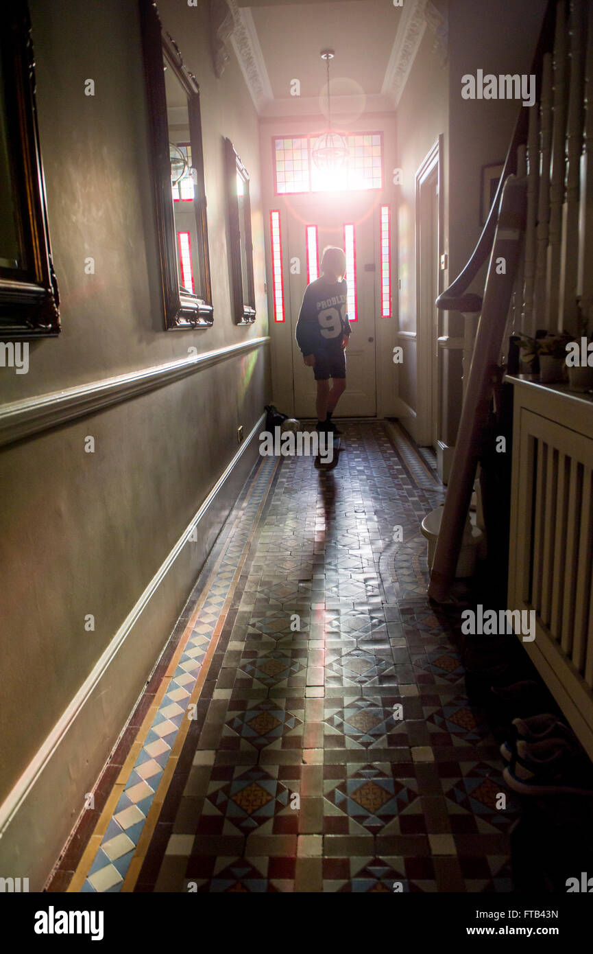 Skateboarding indoors in a Victorian house Stock Photo - Alamy