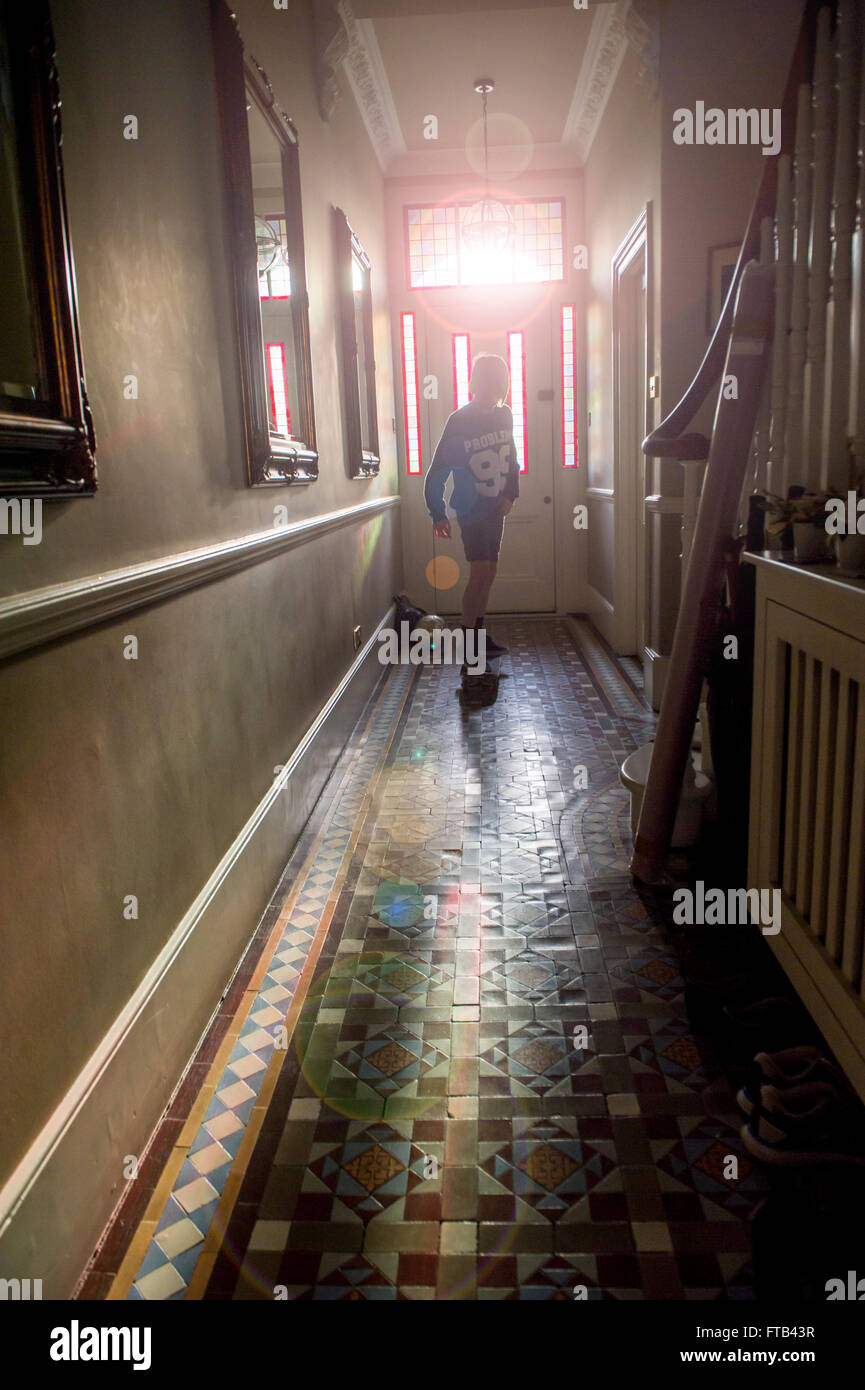 Skateboarding indoors in a Victorian house Stock Photo - Alamy