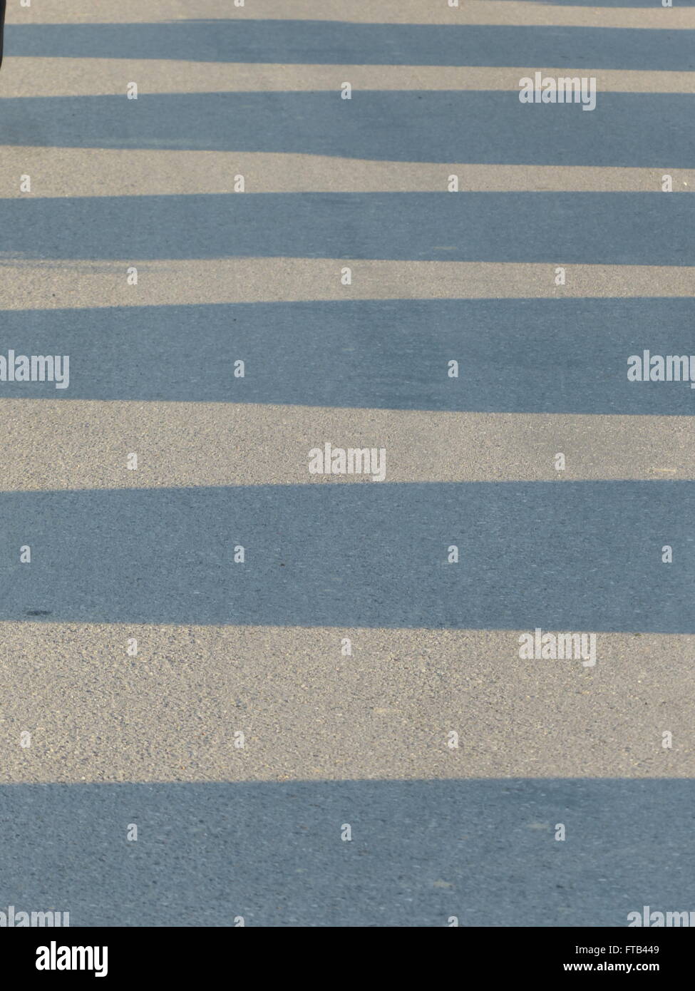 Parked car shadows over the road Stock Photo - Alamy