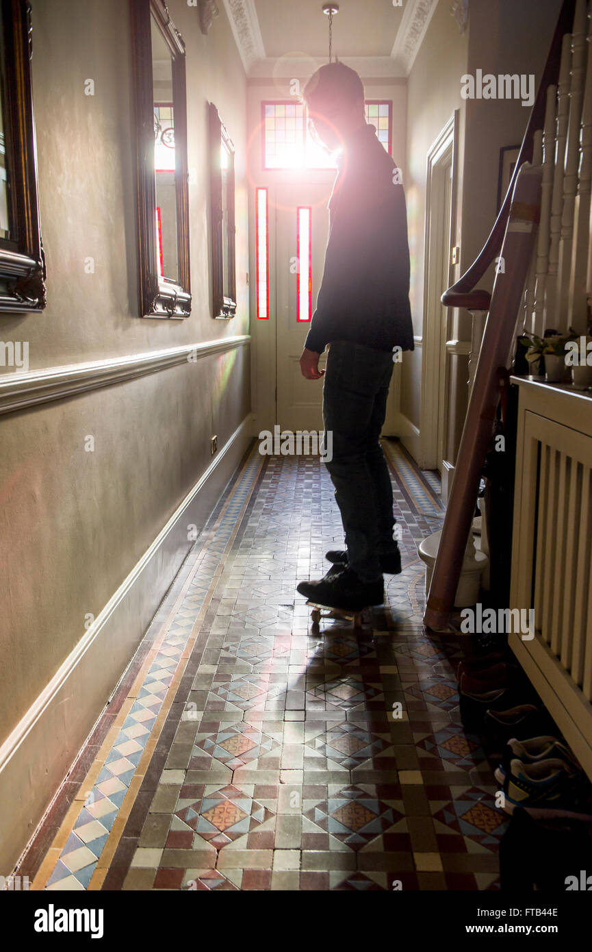 Skateboarding indoors in a Victorian house Stock Photo - Alamy