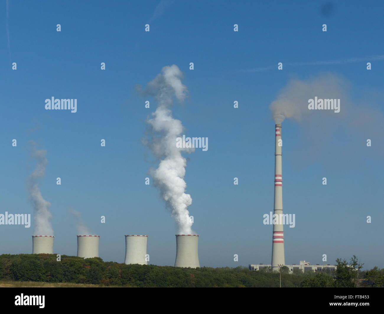Factory smoke polluting the surrounding environment and creates smog ...