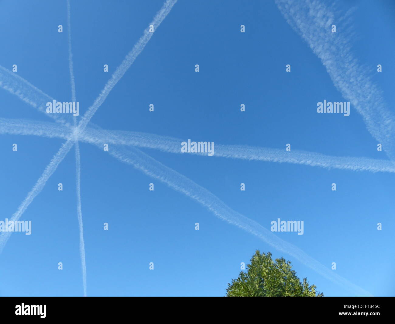 Jet plane exhaust creates various shapes in the sky, such as this star ...