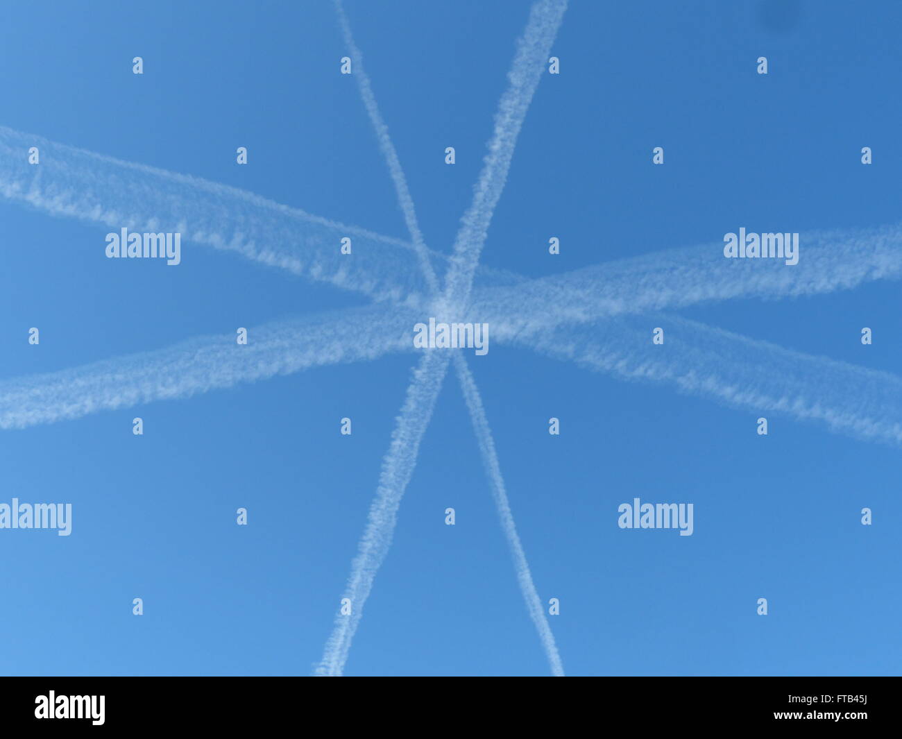 Jet plane exhaust creates various shapes in the sky, such as this star ...