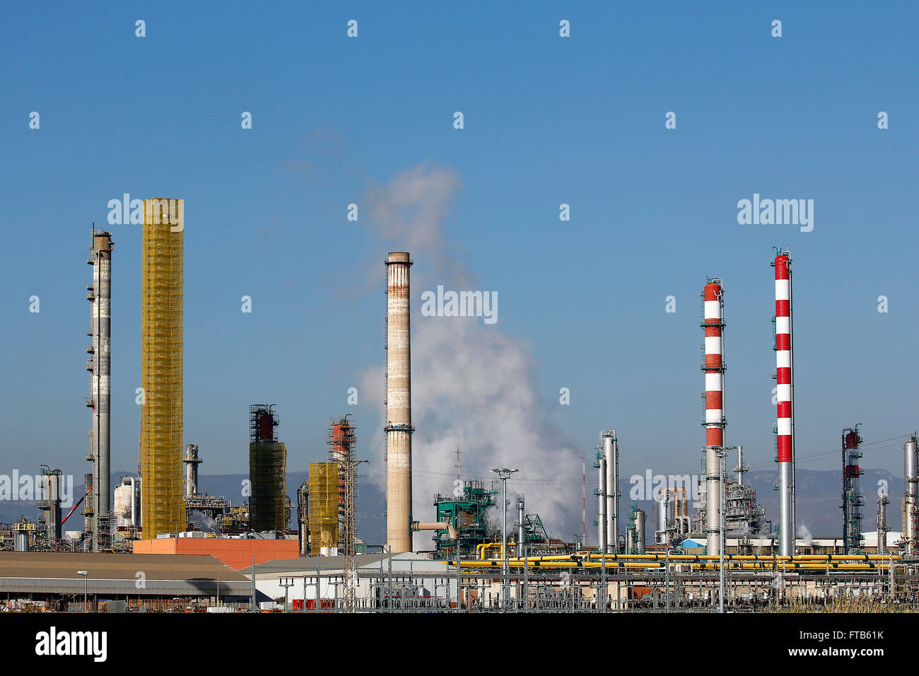 Large oil refinery complex, with chimneys and towers Stock Photo - Alamy